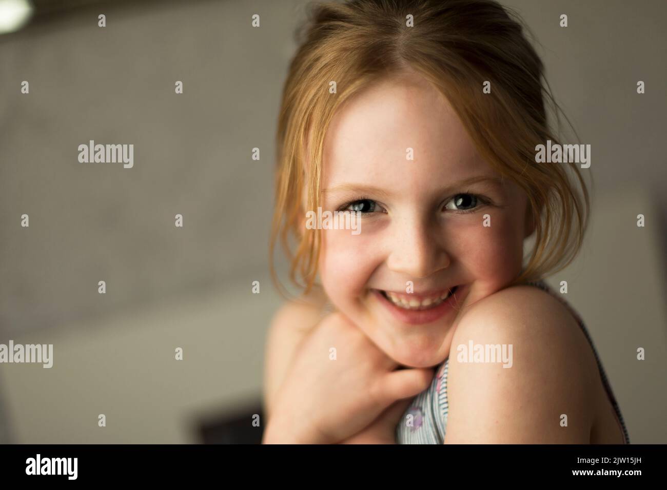 Beautiful young girl poses and looking straight into the camera Stock ...