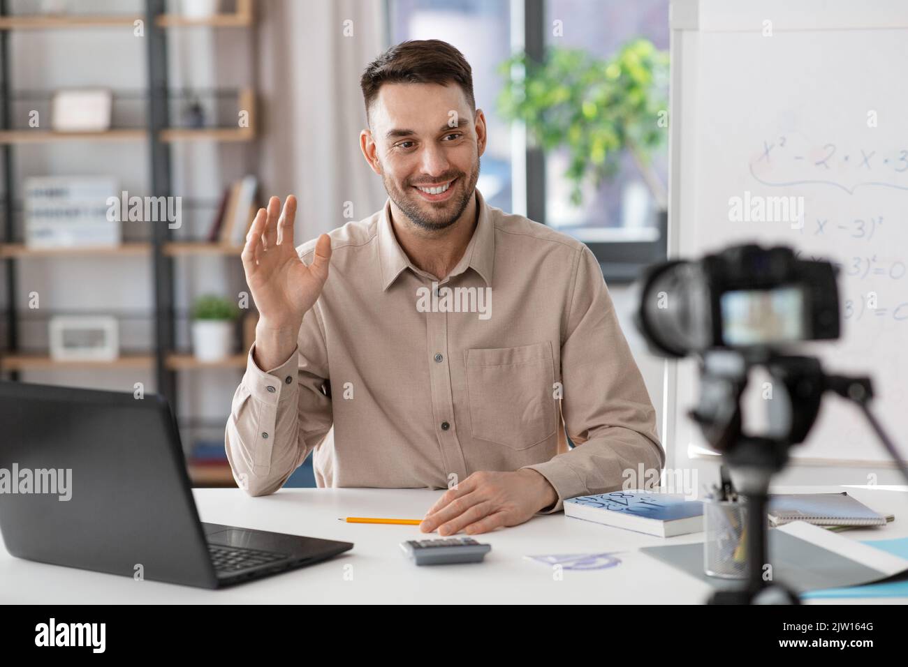male math teacher having online class at home Stock Photo - Alamy