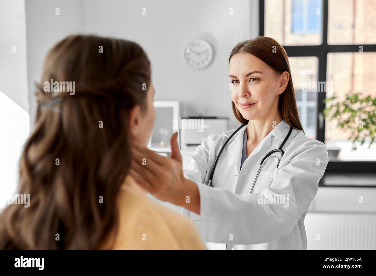 doctor checking lymph nodes of woman at hospital Stock Photo - Alamy