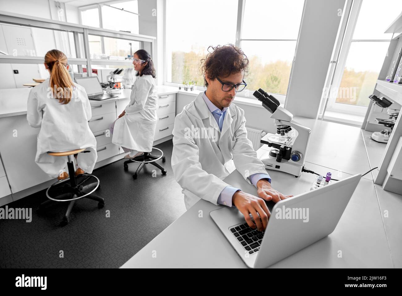 Chemist scientist woman typing biochemistry hi-res stock photography and images - Alamy