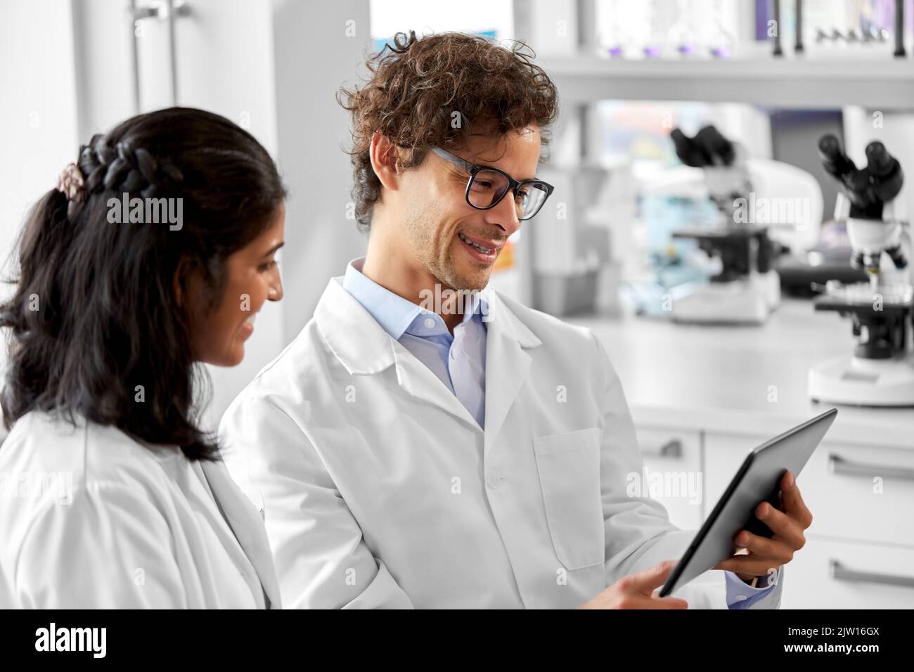 Tablet scientist happy research hi-res stock photography and images - Alamy