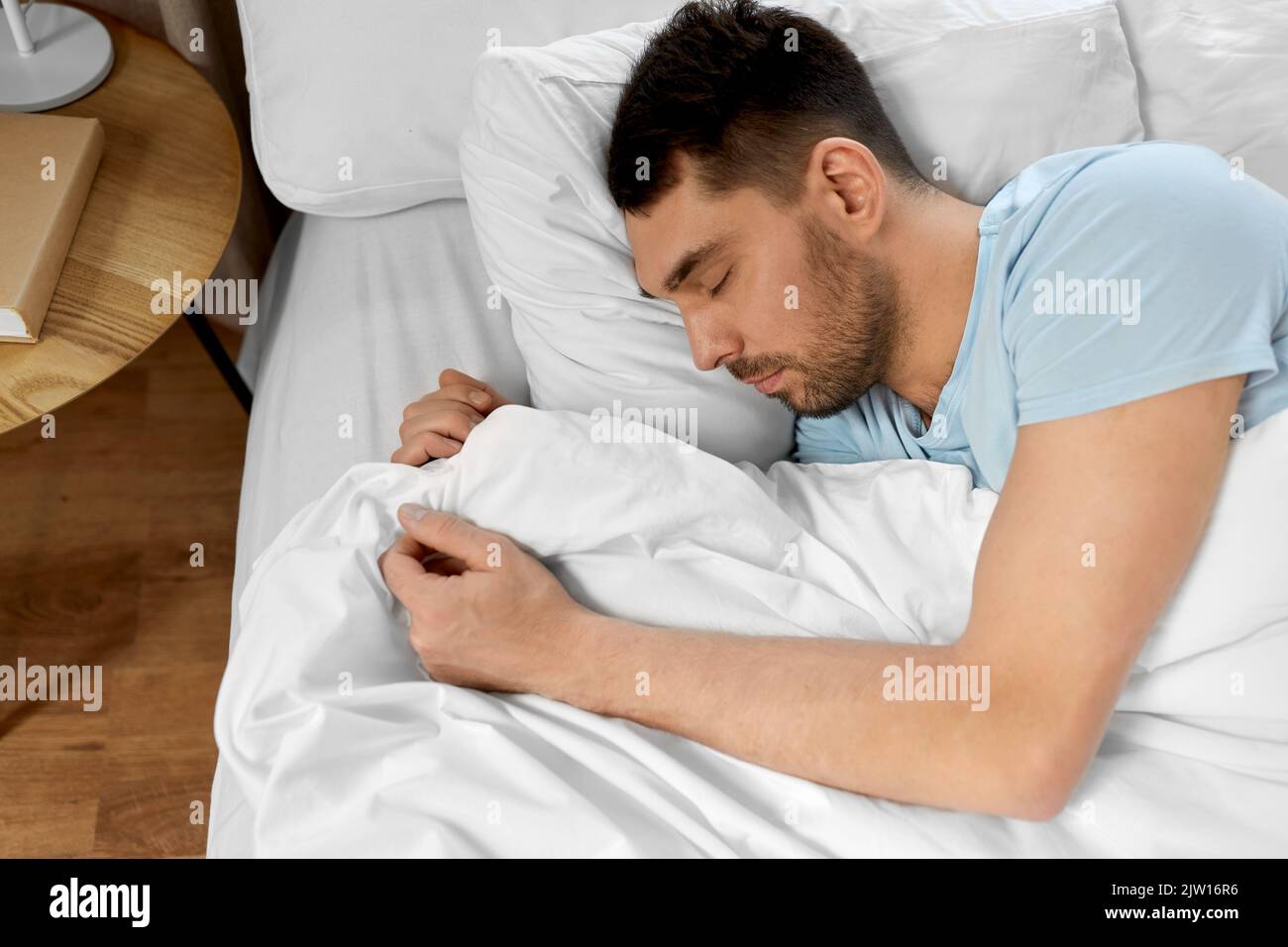 man sleeping in bed at home Stock Photo - Alamy
