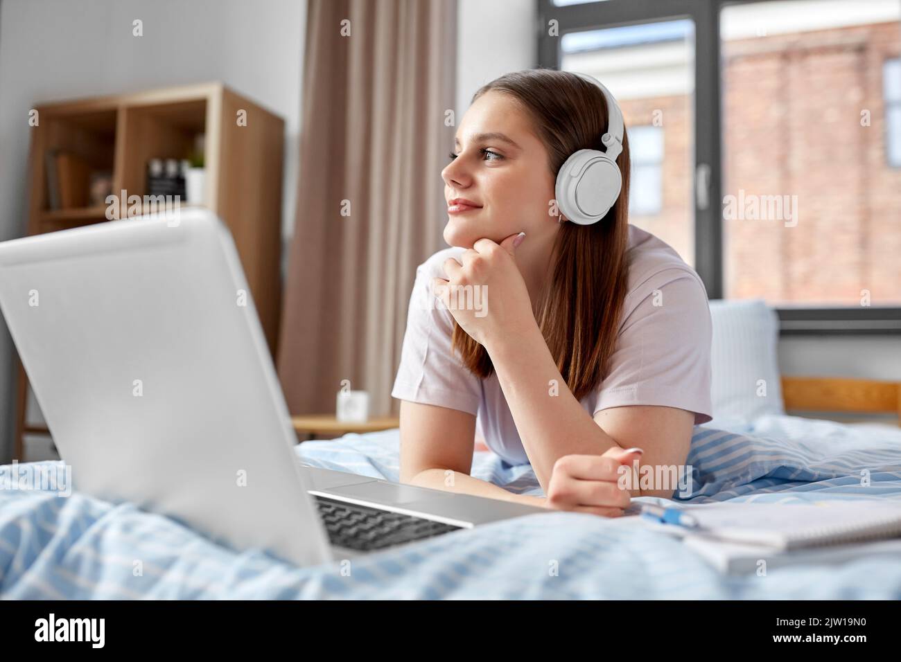 happy student girl in headphones learning at home Stock Photo - Alamy