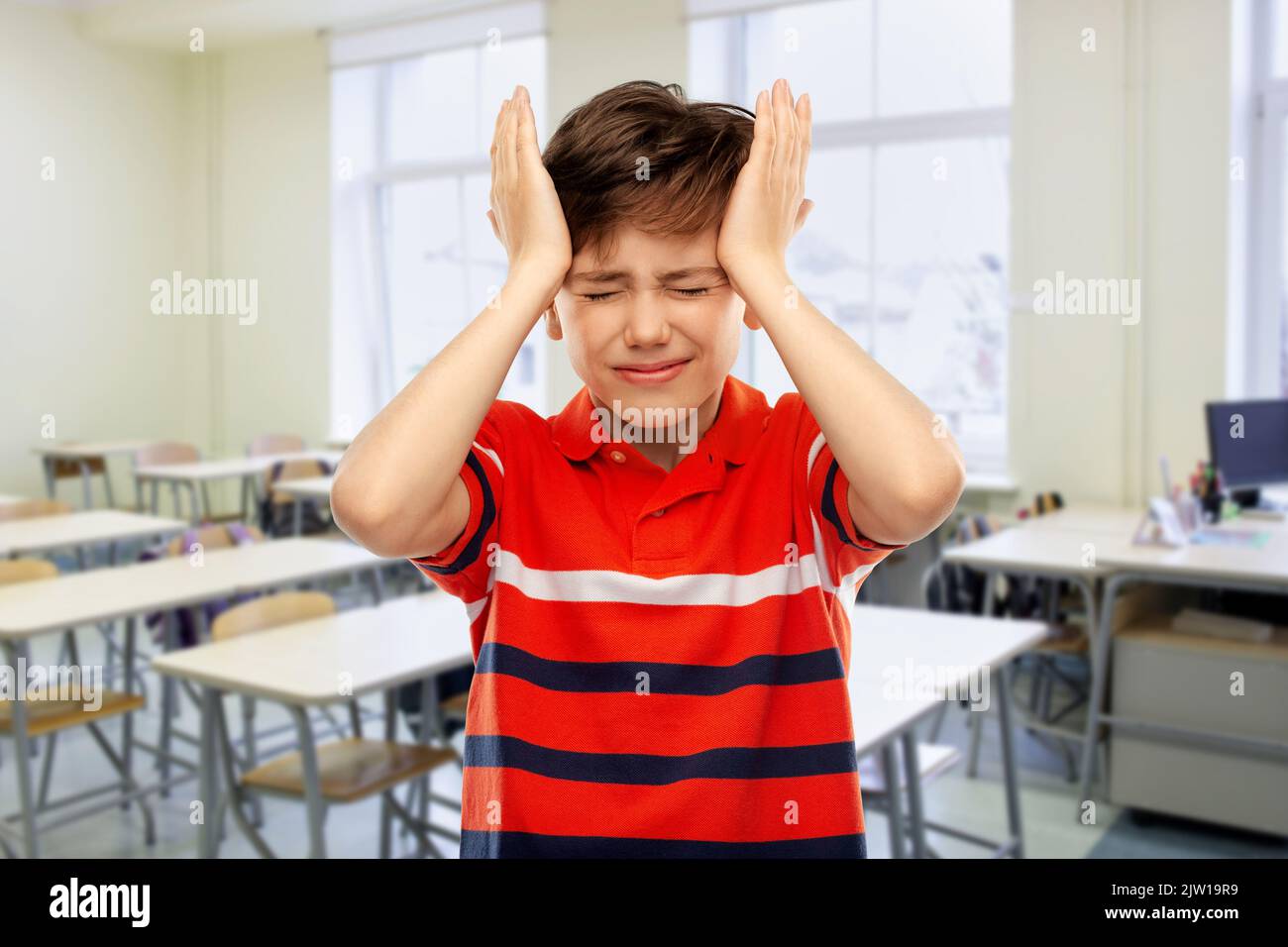 stressed student boy having headache at school Stock Photo - Alamy