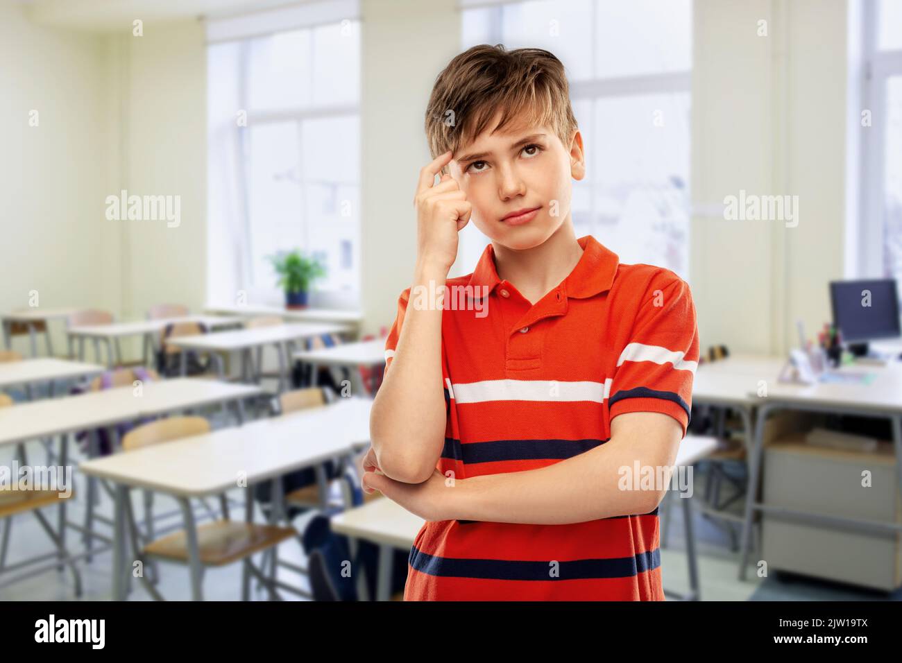 thinking student boy at school Stock Photo - Alamy
