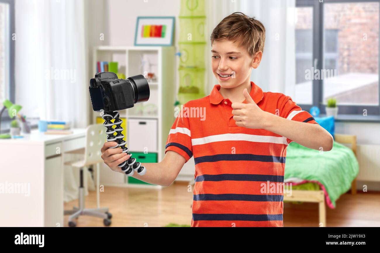 boy video blogger with camera showing thumbs up Stock Photo - Alamy
