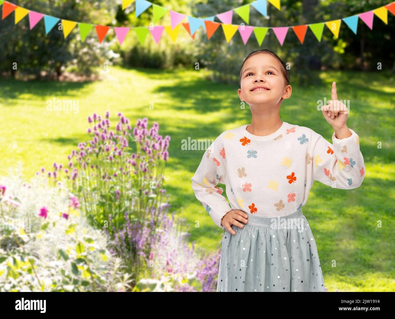 happy girl pointing finger up at garden party Stock Photo - Alamy happy girl pointing finger up at garden party Stock Photo - Alamy