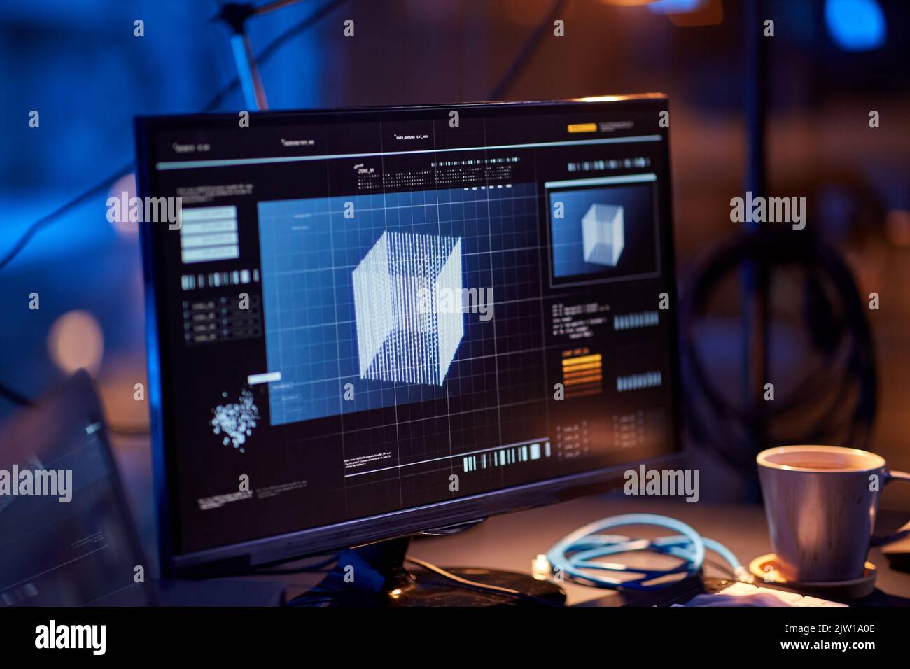 graphic 3d shape on computer monitor in dark room Stock Photo - Alamy