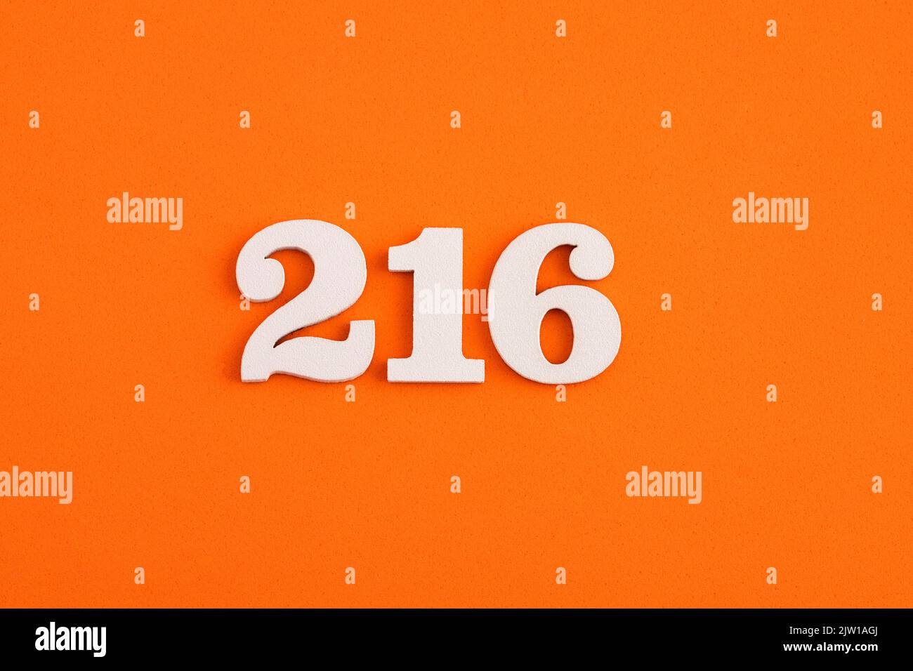 White wooden number 216 on eva rubber orange background Stock Photo - Alamy