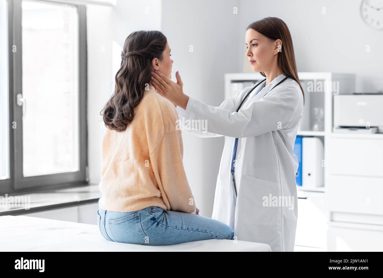 doctor checking lymph nodes of woman at hospital Stock Photo - Alamy