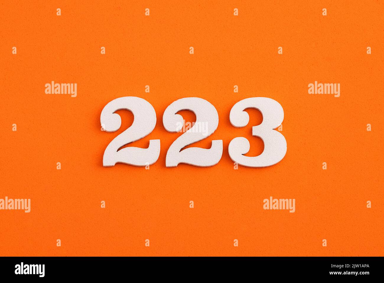 Number 223 - On orange foam rubber background Stock Photo - Alamy