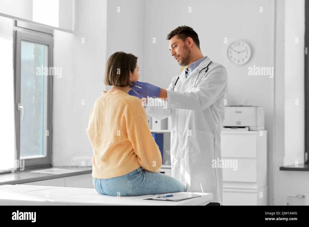 doctor checking lymph nodes of woman at hospital Stock Photo - Alamy