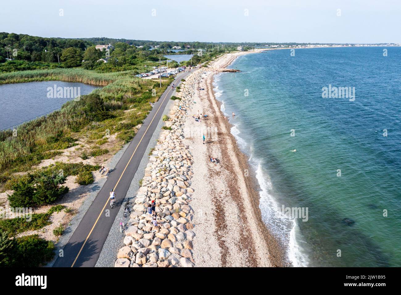 Aerial Drone of Woman biking Cape Cod beaches coastal bike path Stock ...