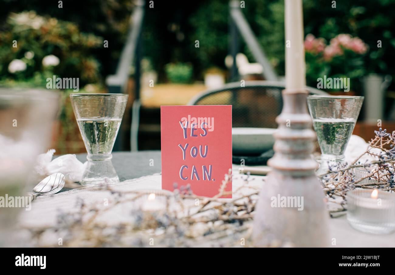 encouraging positive greeting card on a decorated dinner table Stock ...