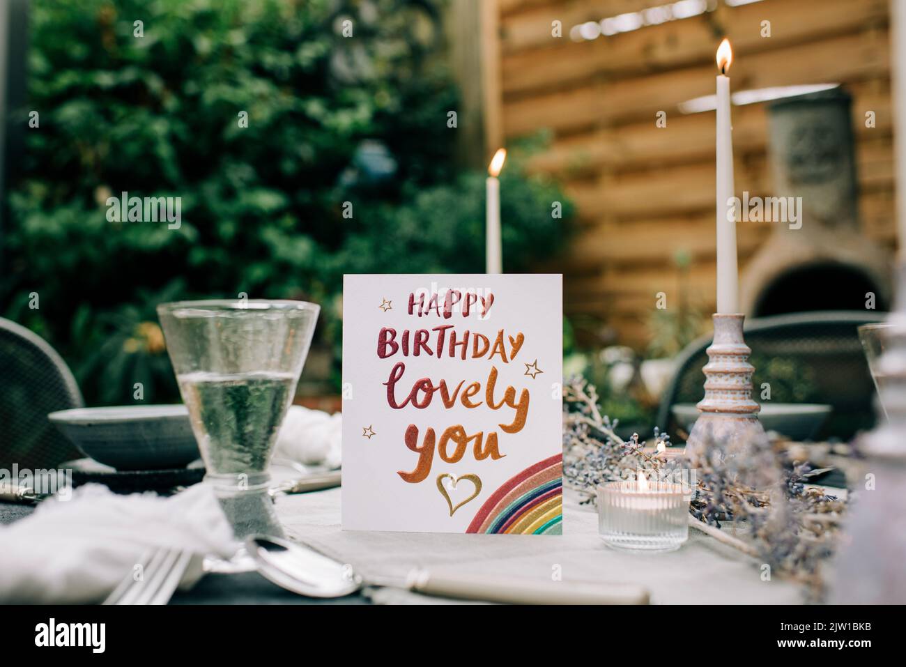 birthday greeting card on a decorated dinner table Stock Photo - Alamy