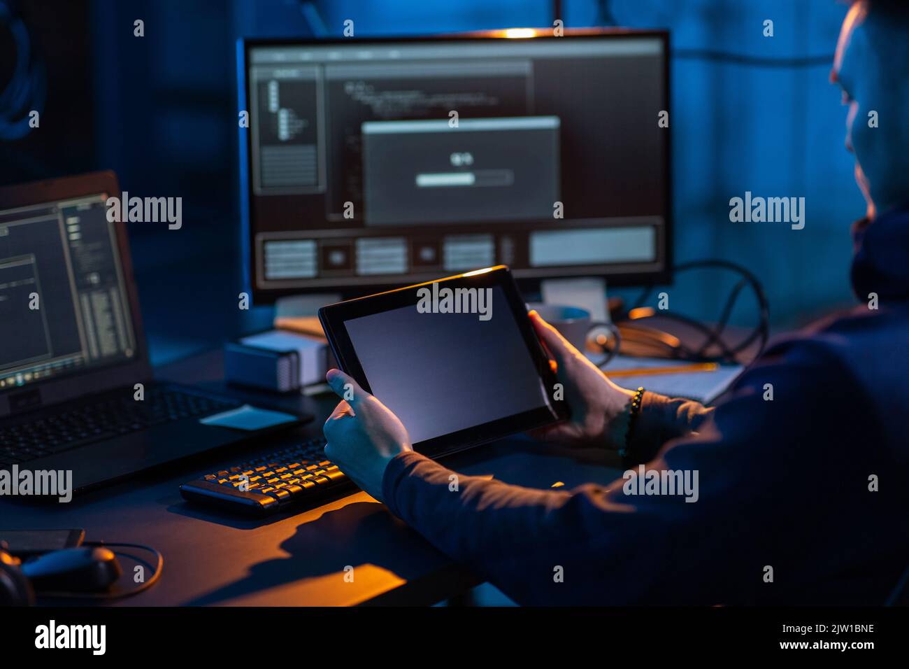 hacker using tablet pc computer for cyber attack Stock Photo - Alamy