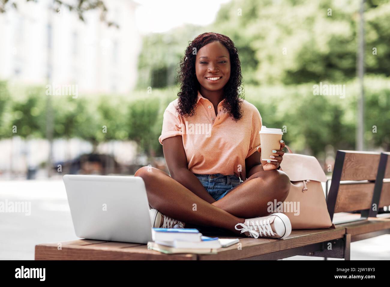 african student girl with coffee, laptop and books Stock Photo - Alamy