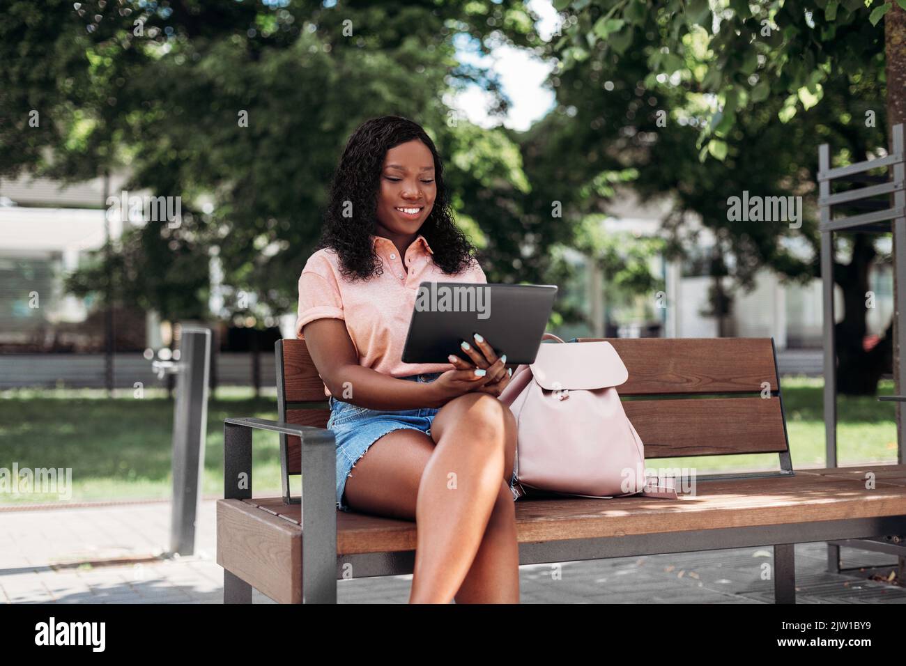 african american woman with tablet pc in city Stock Photo - Alamy
