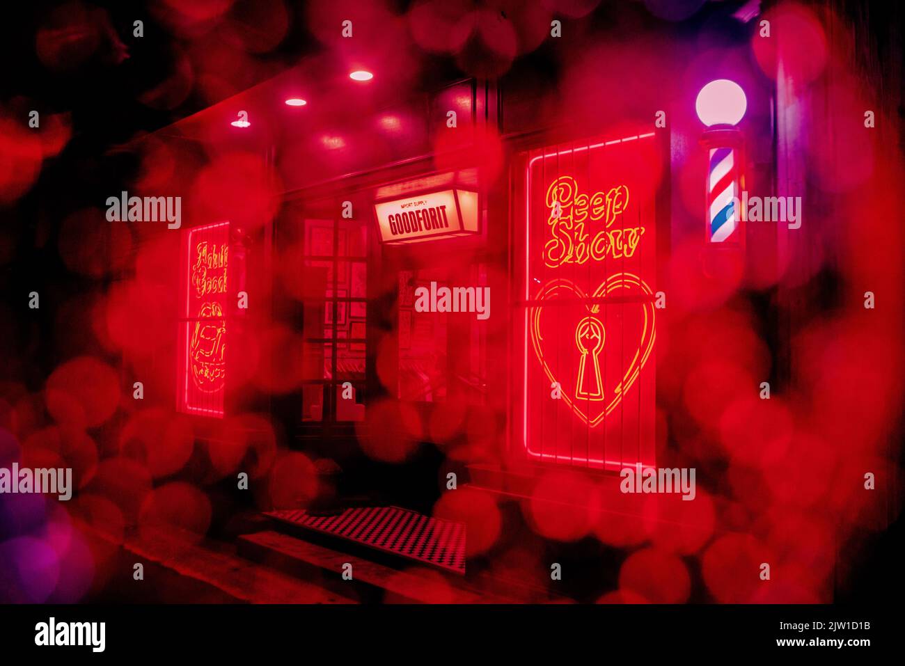 A beautiful shot of neon-soaked streets in Taipei, Taiwan while raining ...