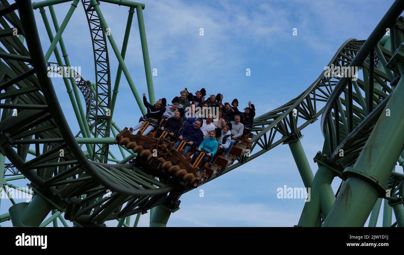 Young people screaming during a ride at Hansapark roller coaster "Der ...
