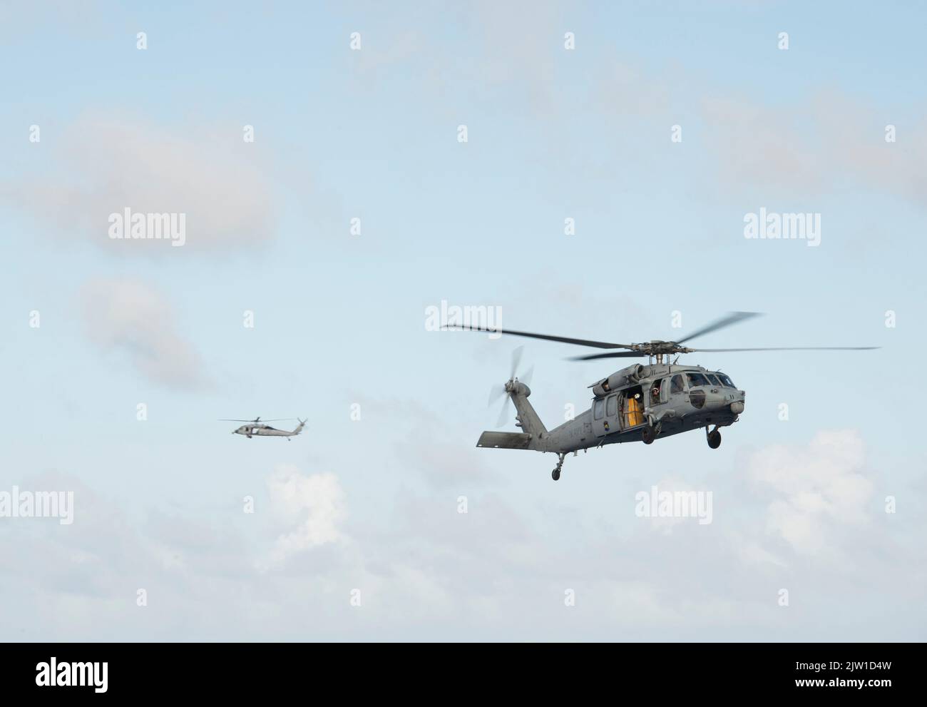 EAST CHINA SEA (Aug. 31, 2022) Two MH-60S Sea Hawk helicopters, both ...