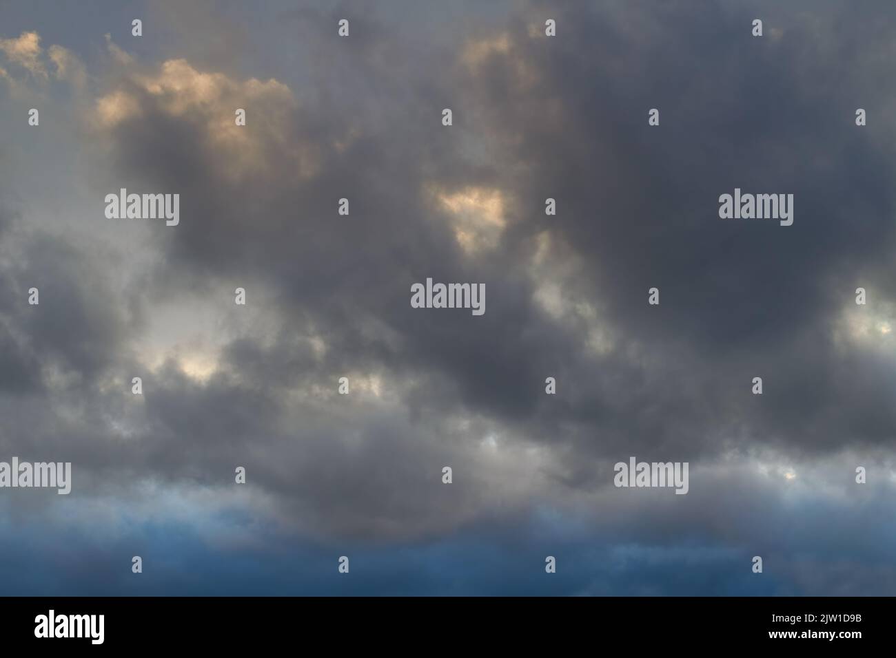 Evening sky in the picturesque clouds, lit by the rays of the setting ...