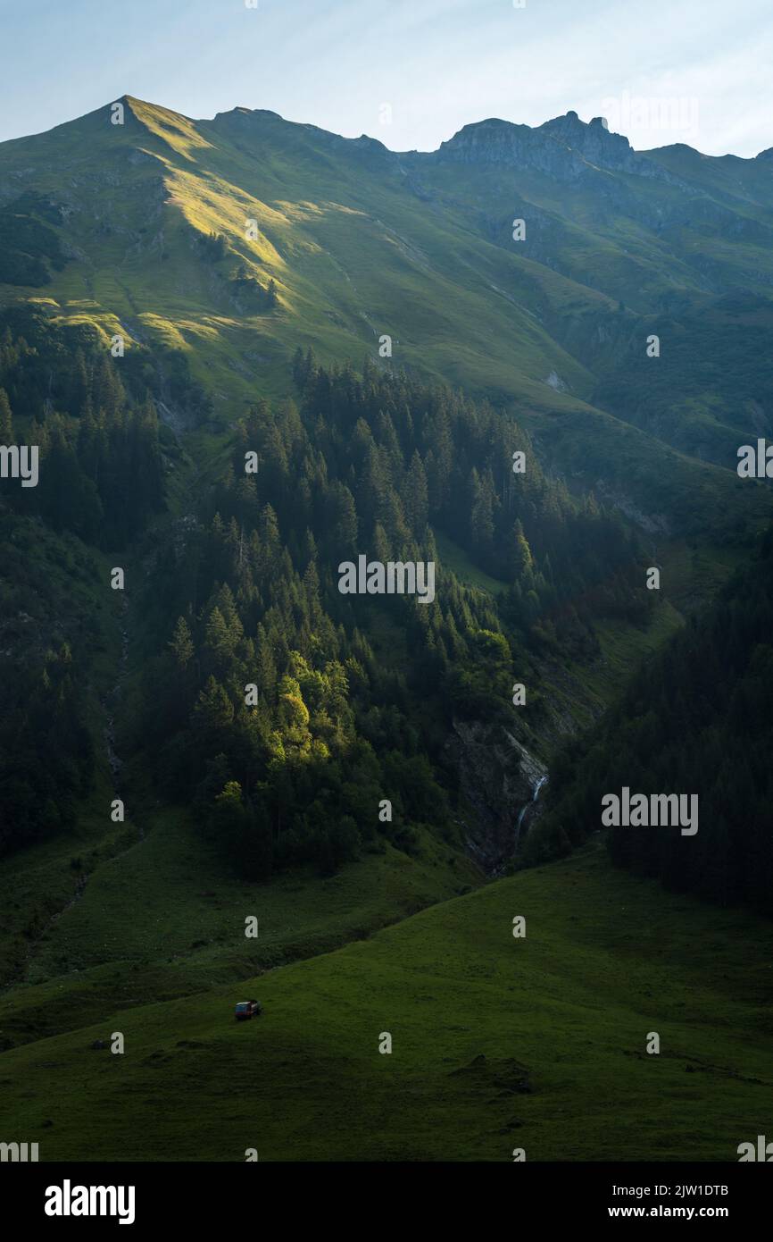 A vertical shot of a beautiful mountainous landscape covered in ...