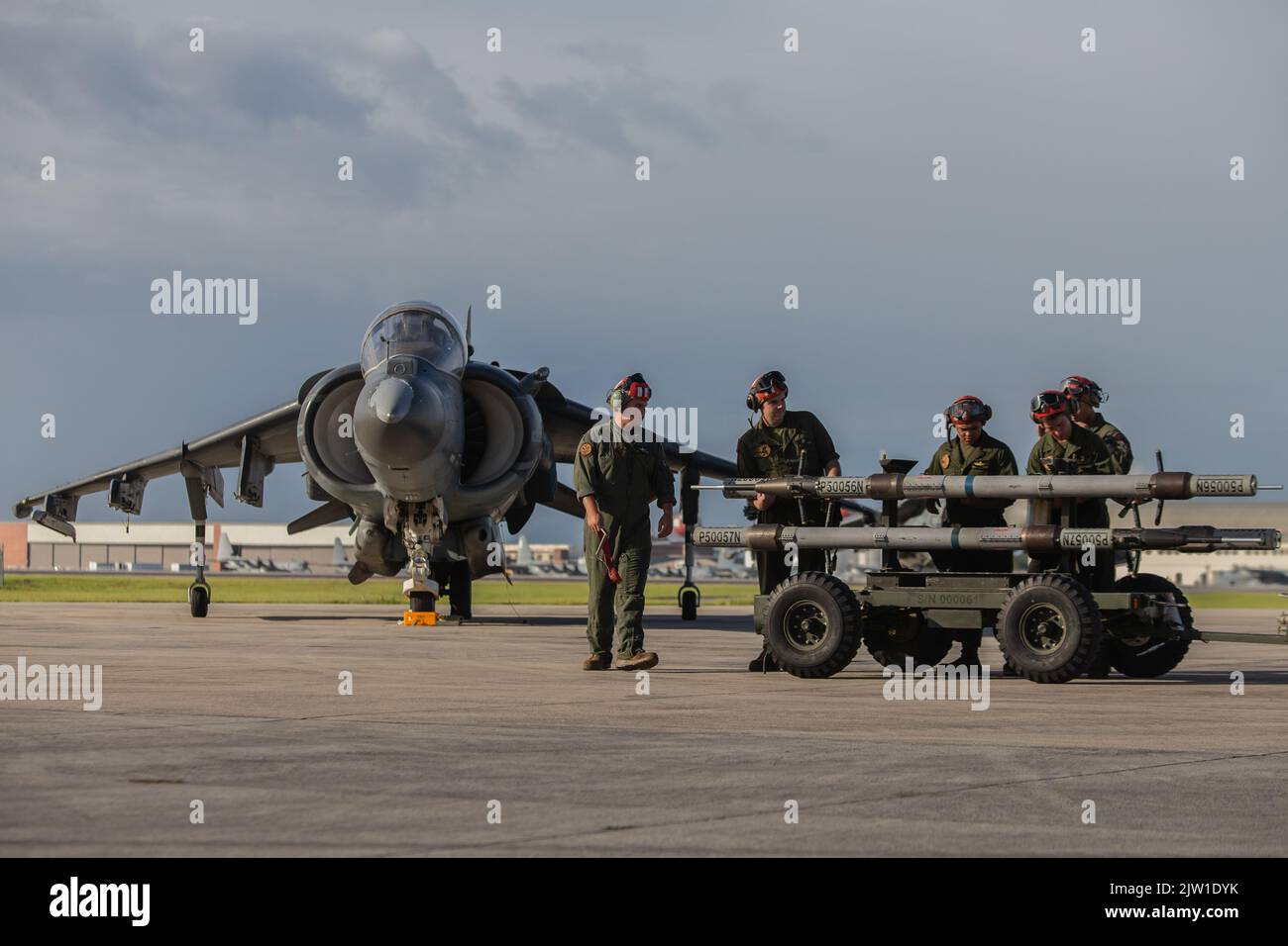 U.S. Marines with Marine Attack Squadron (VMA) 223 prepare to load ...