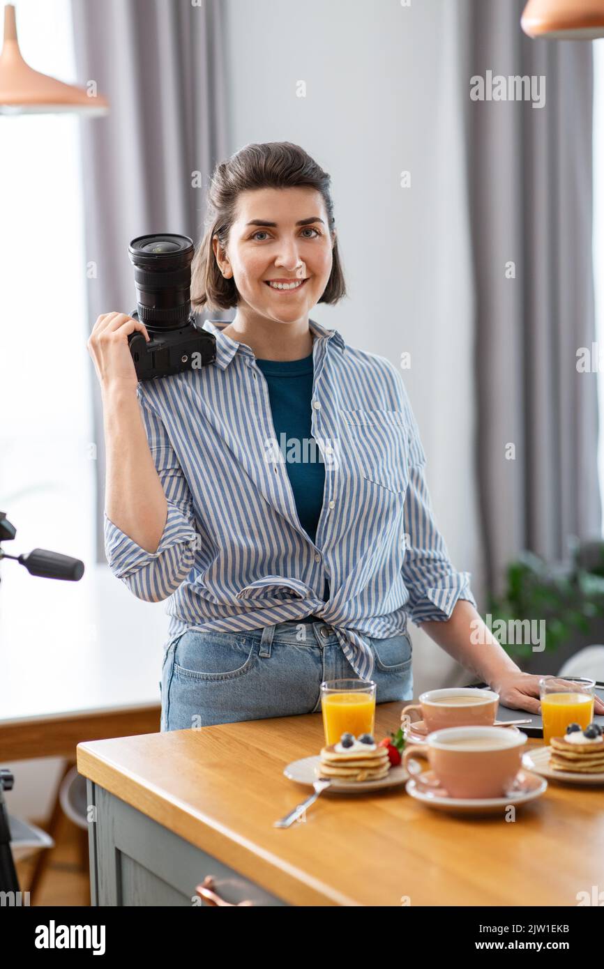 food photographer with camera working in kitchen Stock Photo - Alamy