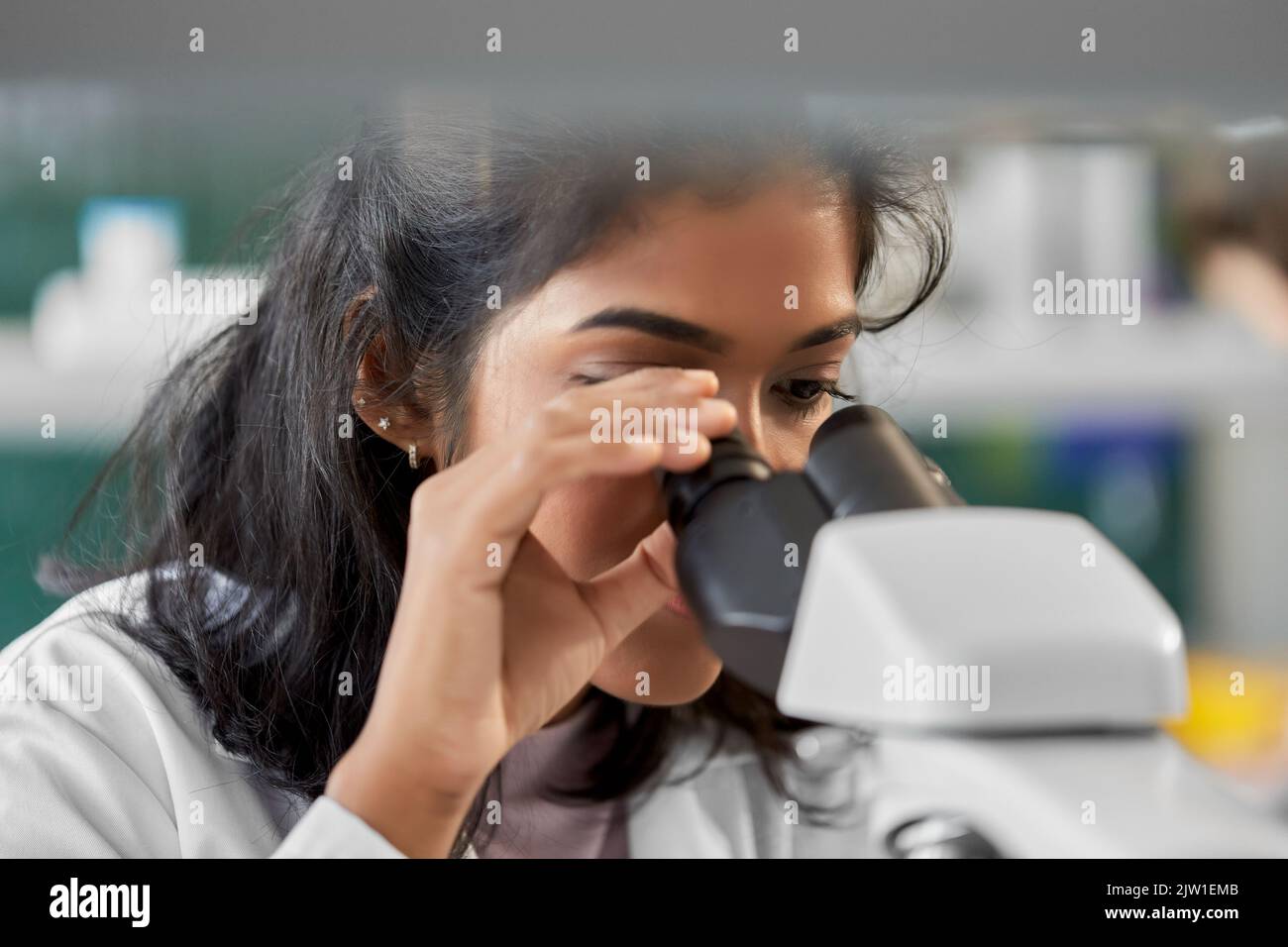 Indian doctor with microscope hi-res stock photography and images - Alamy
