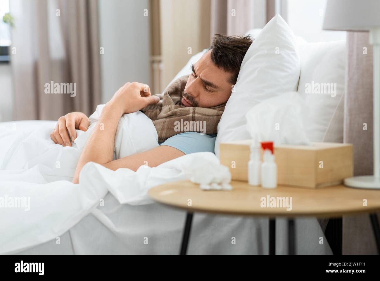 sick man sleeping in bed at home Stock Photo - Alamy