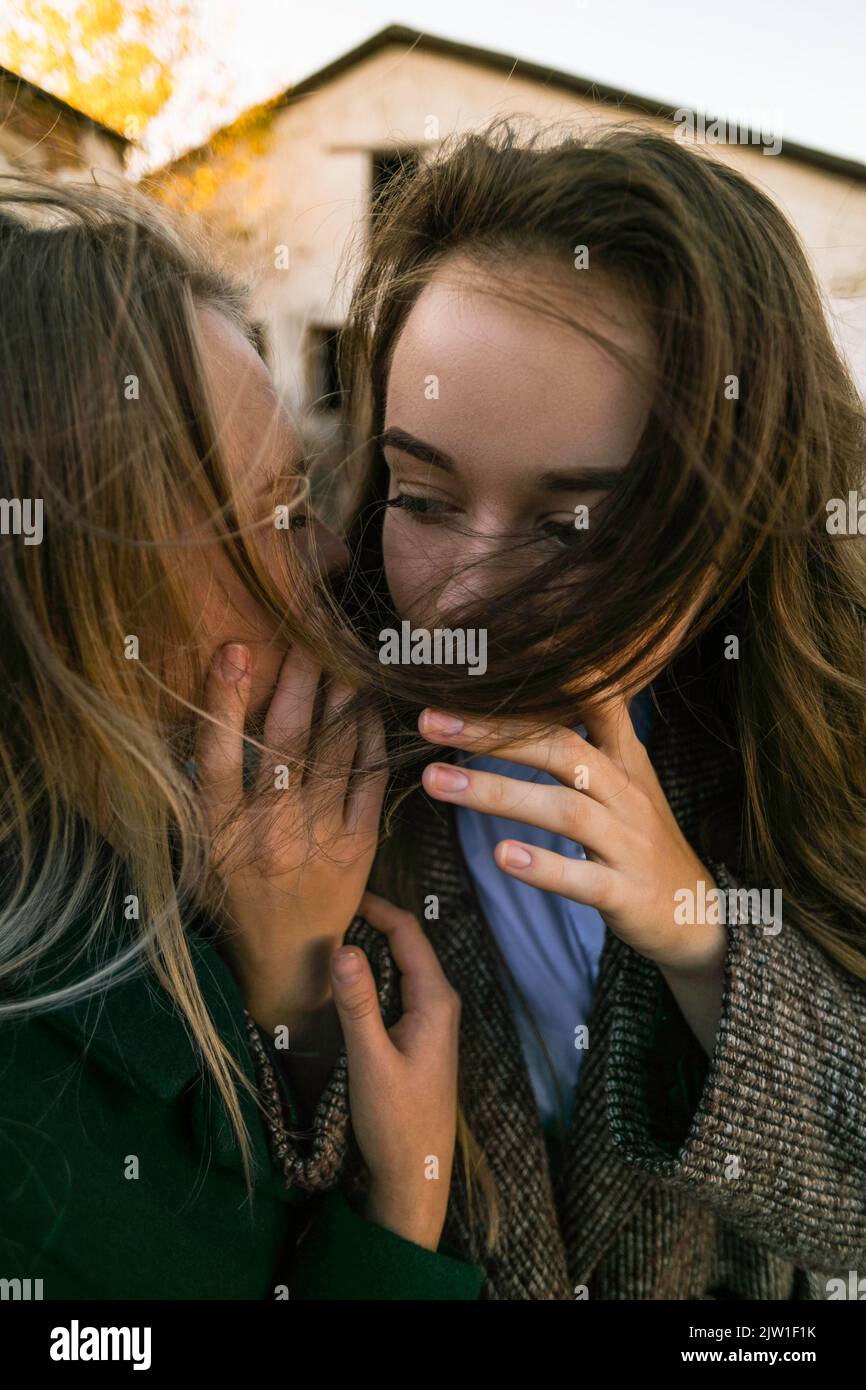 Two excited young girls, people, communication and friendship concept ...