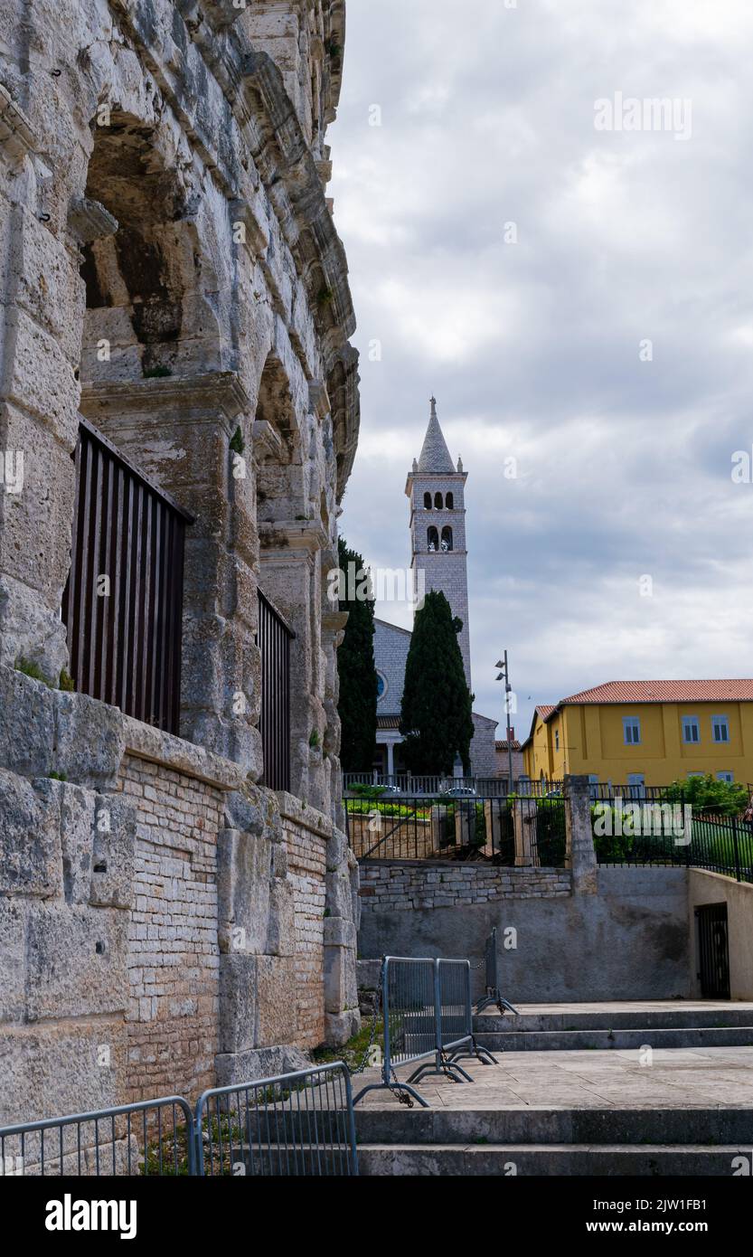 The old and the new stand together as St. Anthony's church steeple ...