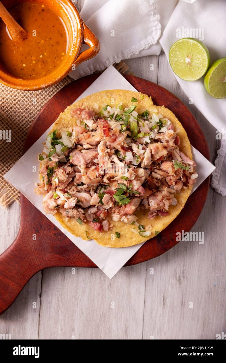 Taco de Carnitas. Cornmeal tortilla with deep fried pork. Traditional ...