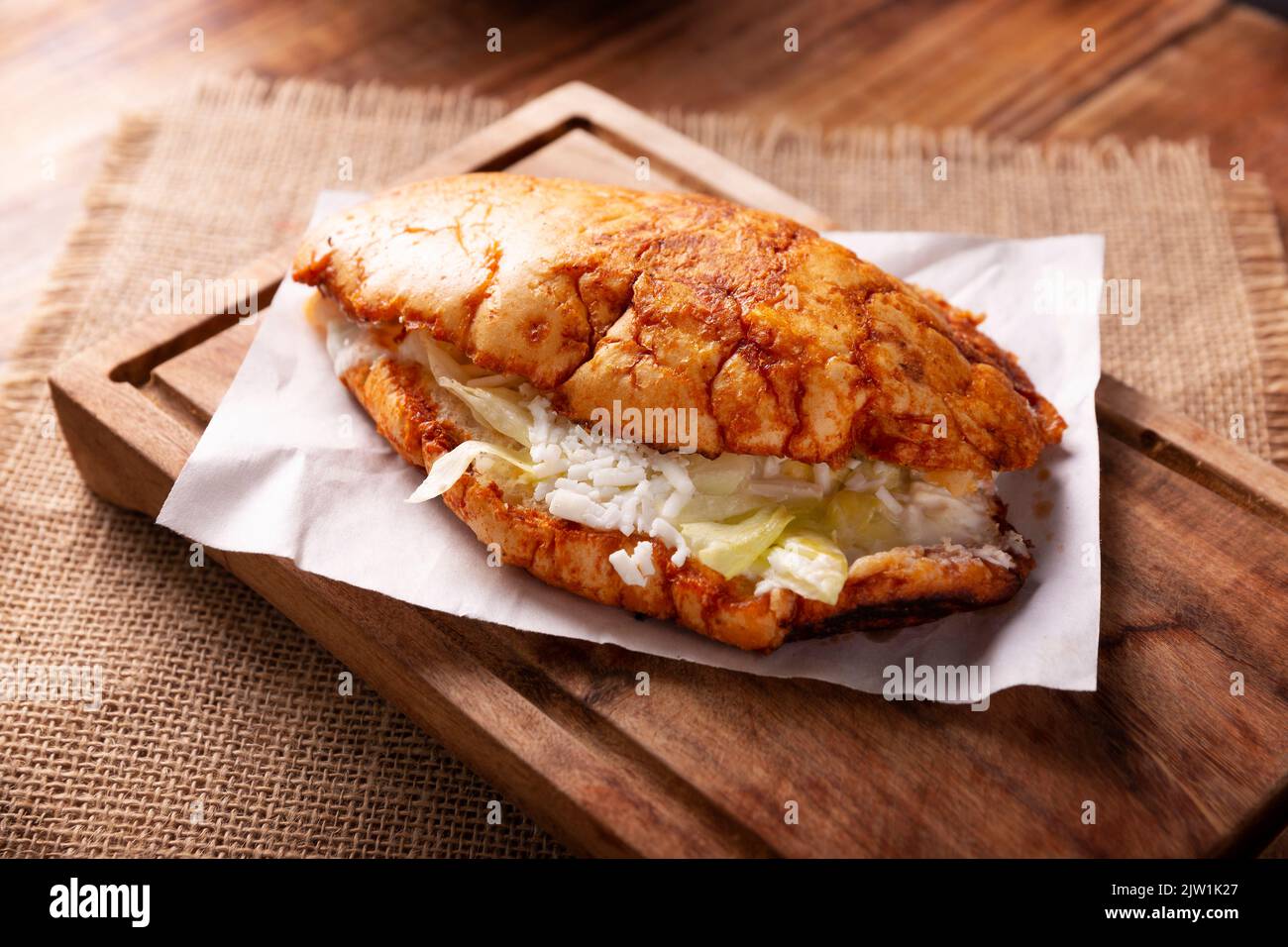 Pambazo. Sandwich marinated in sauce and roasted on a comal ...