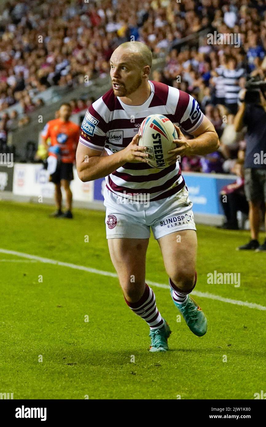 Liam Marshall #5 of Wigan Warriors crosses the line to score during the ...