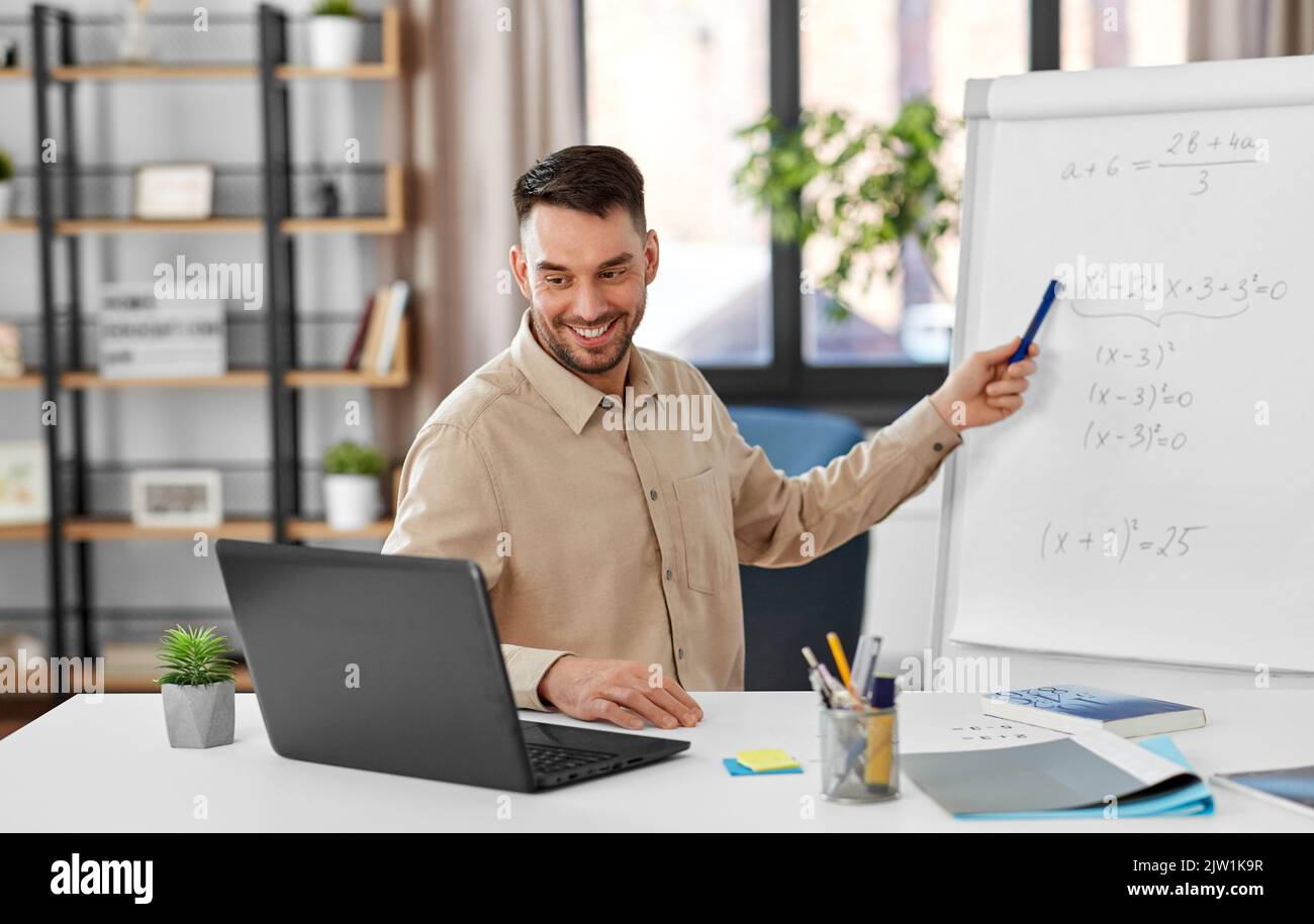 math teacher with laptop has online class at home Stock Photo - Alamy
