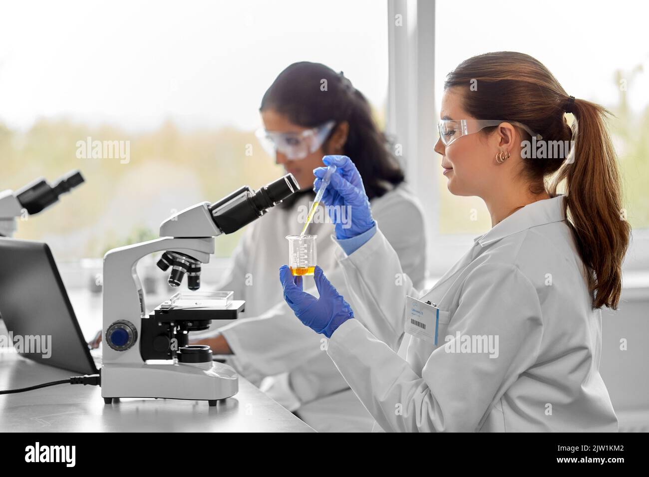 Scientists working microscope test hi-res stock photography and images ...