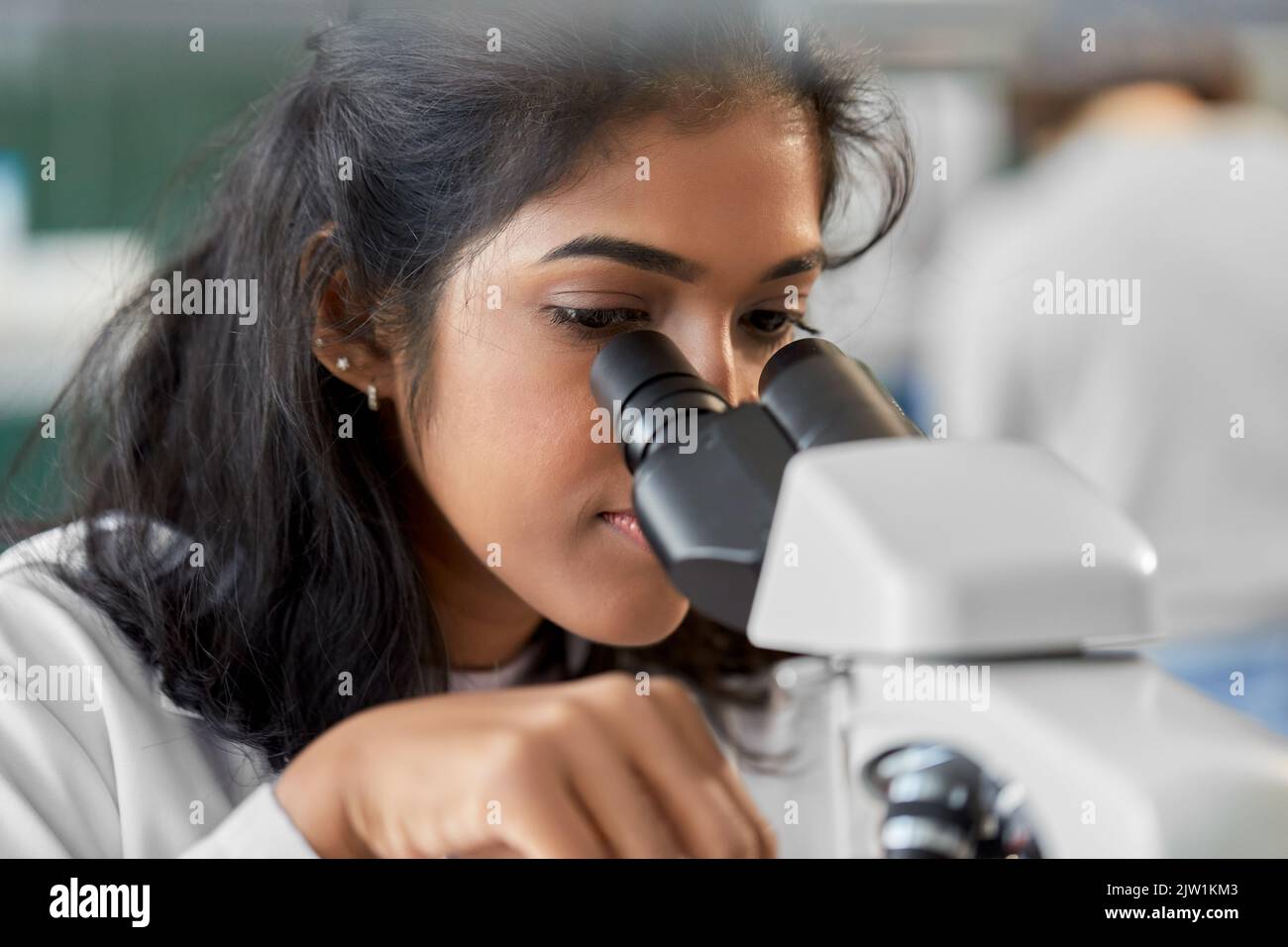 Indian doctor with microscope hi-res stock photography and images - Alamy