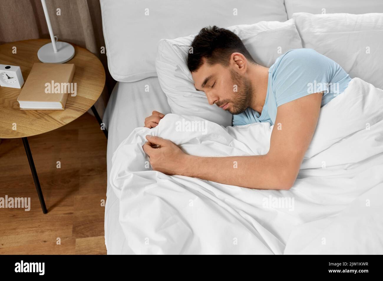 man sleeping in bed at home Stock Photo - Alamy