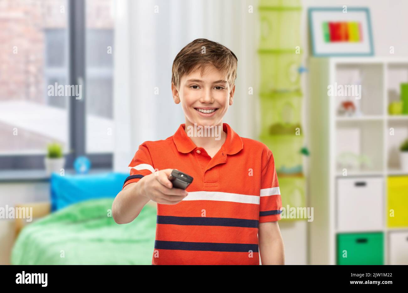 Boy tv remote hi-res stock photography and images - Alamy