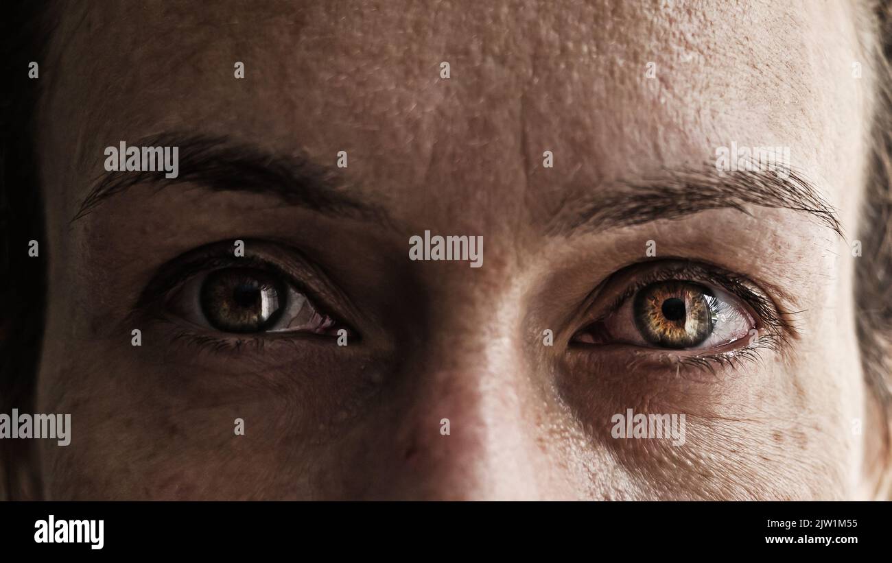 Womans aged face with beautiful eyes. Close up Stock Photo - Alamy