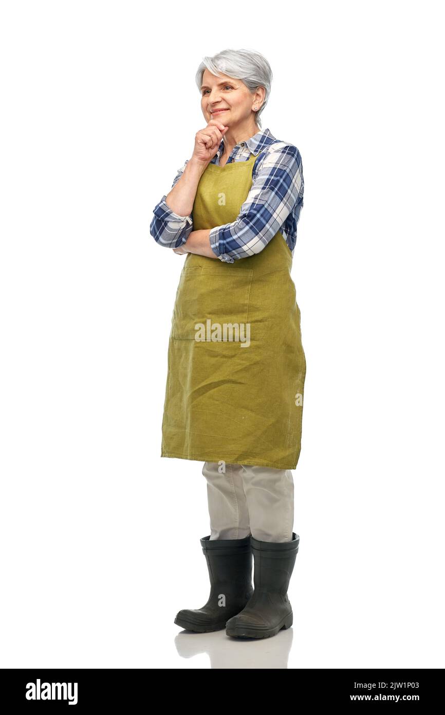 Pensive mature woman in apron hi-res stock photography and images - Alamy