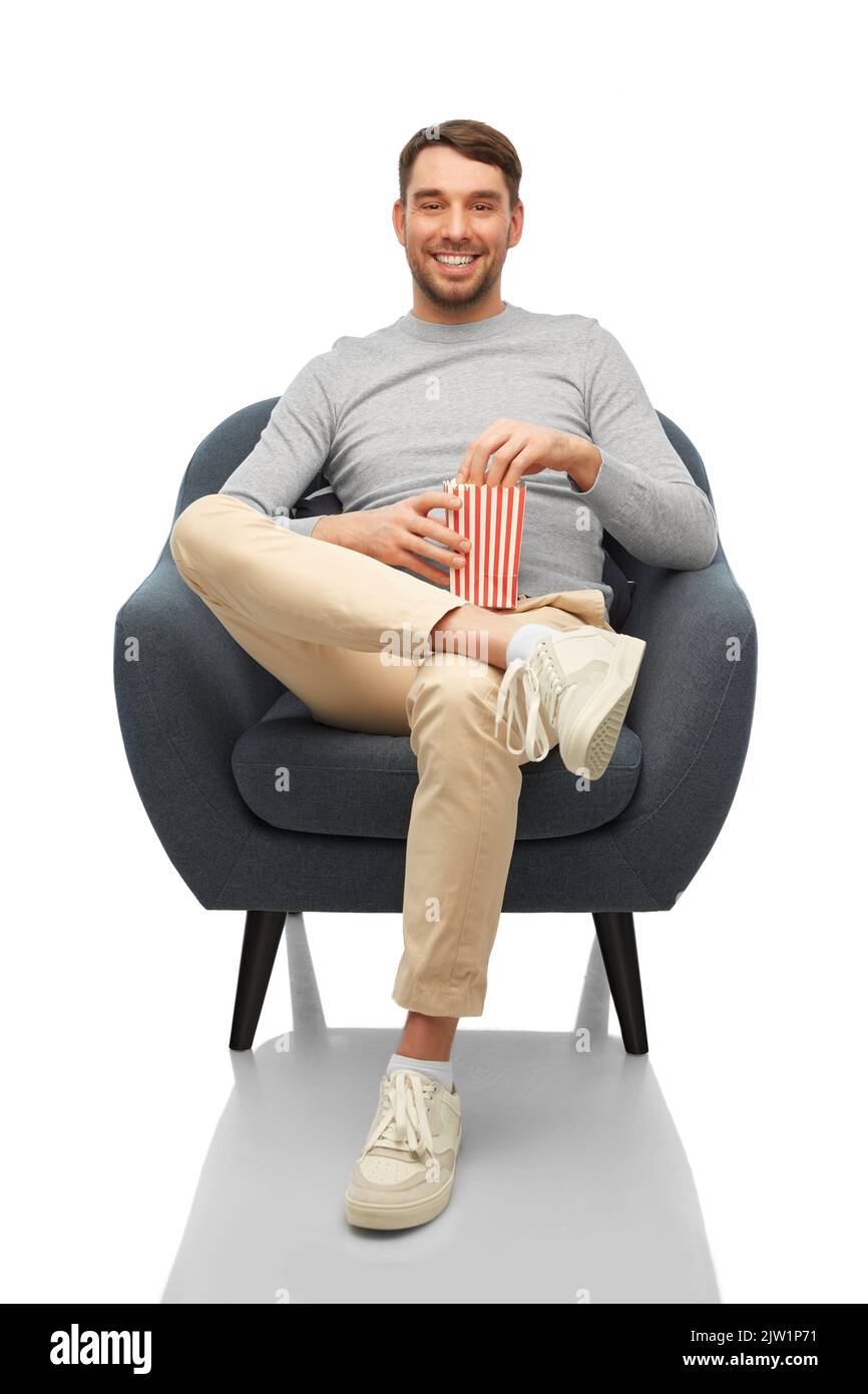 Man armchair popcorn hi-res stock photography and images - Alamy