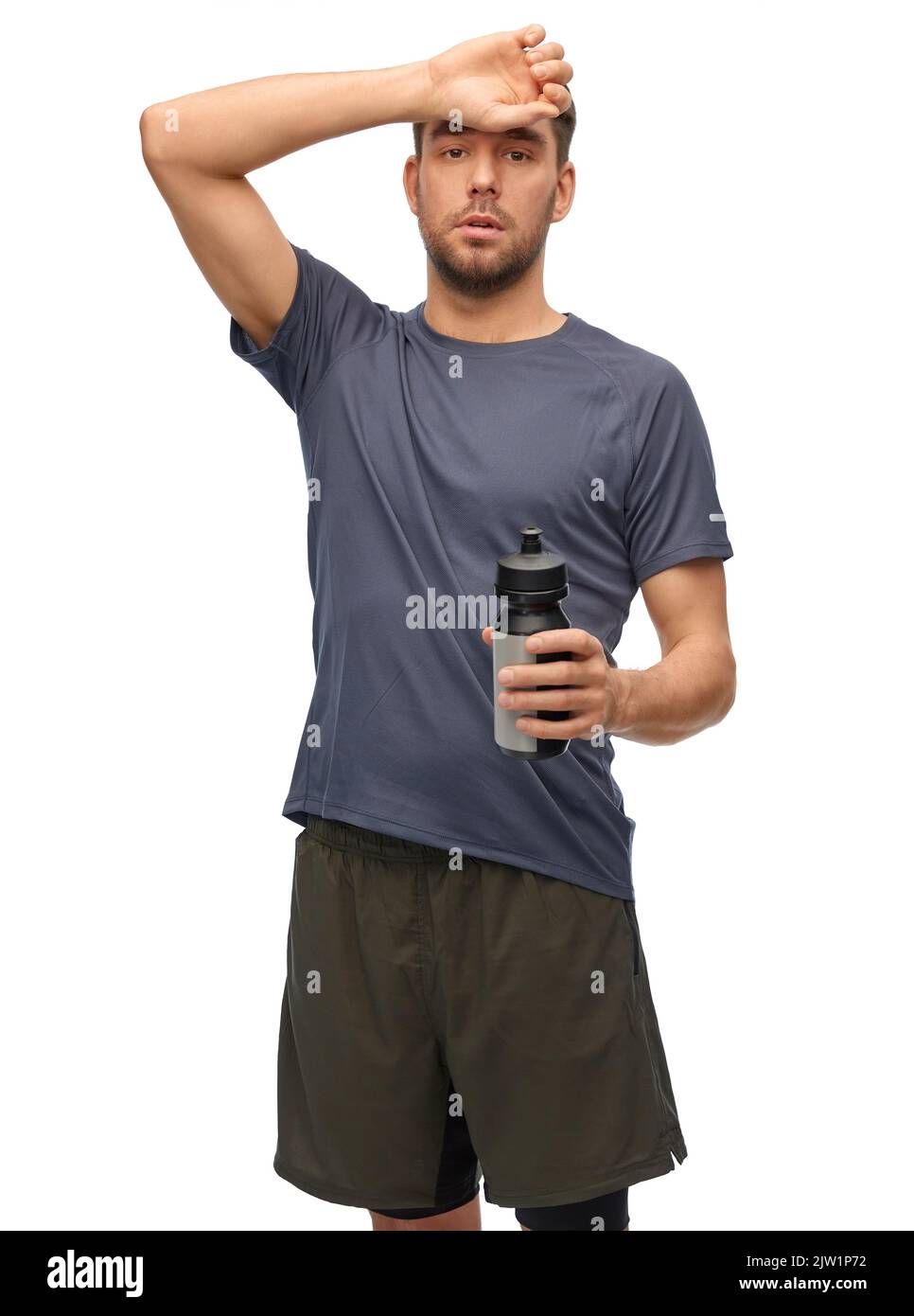 tired man in sports clothes with bottle Stock Photo - Alamy