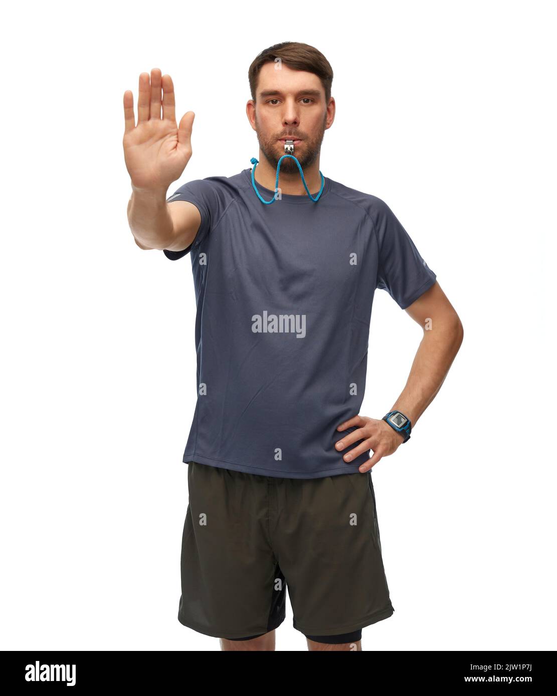 trainer or referee with whistle showing stop gesture Stock Photo - Alamy