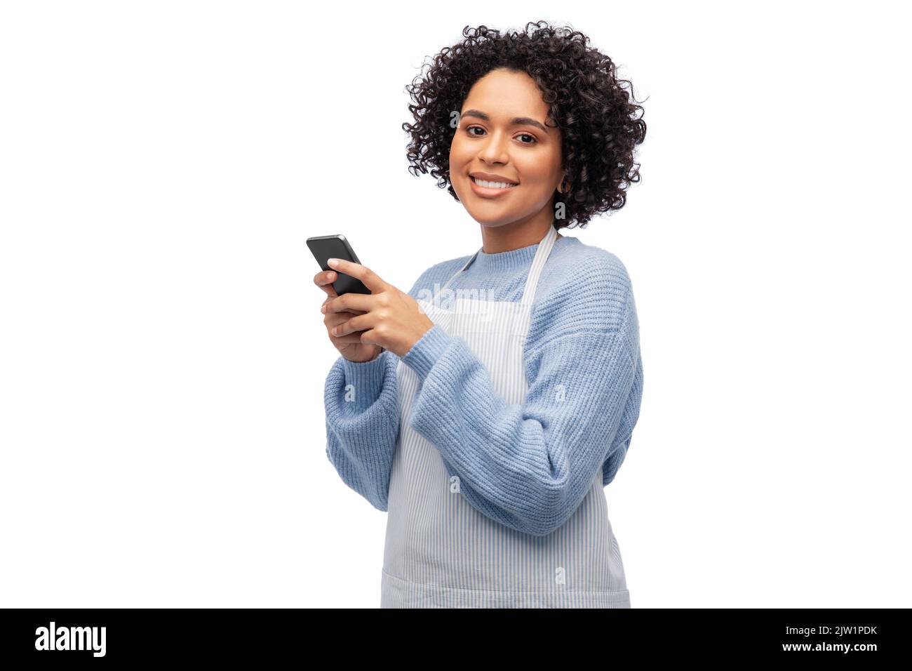 Cheerful black woman in apron hi-res stock photography and images - Alamy