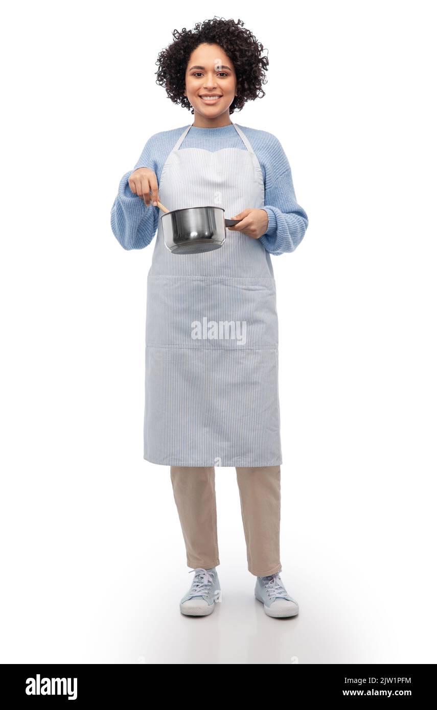happy woman in apron cooking food in saucepan Stock Photo - Alamy