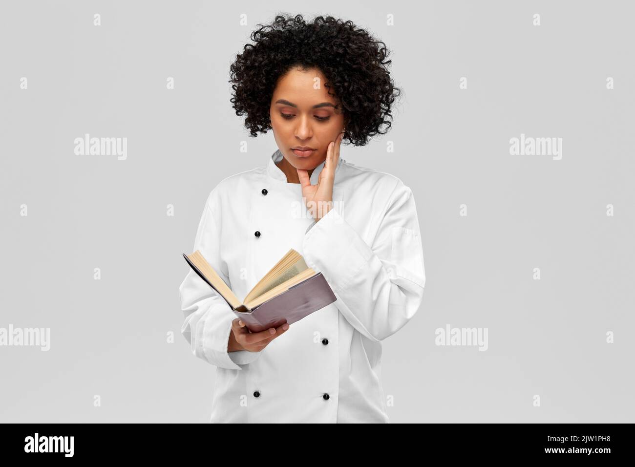 African woman reading book isolated hi-res stock photography and images ...