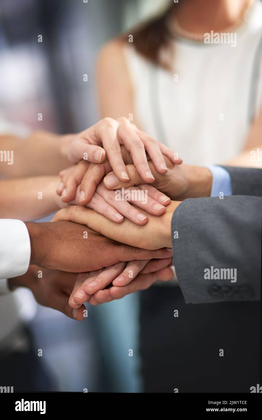 All for one and one for all. a group of unrecognizable businesspeople ...